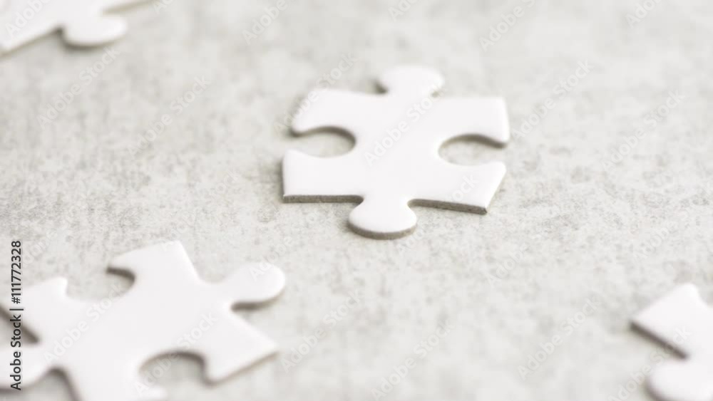 Blank white puzzle pieces as symbol of team work Stock Video | Adobe Stock