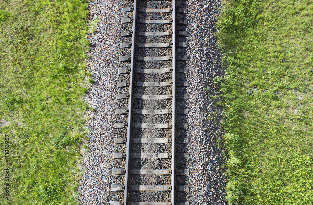 Railway top view. Railroad and green grass on the sides. The part of ...