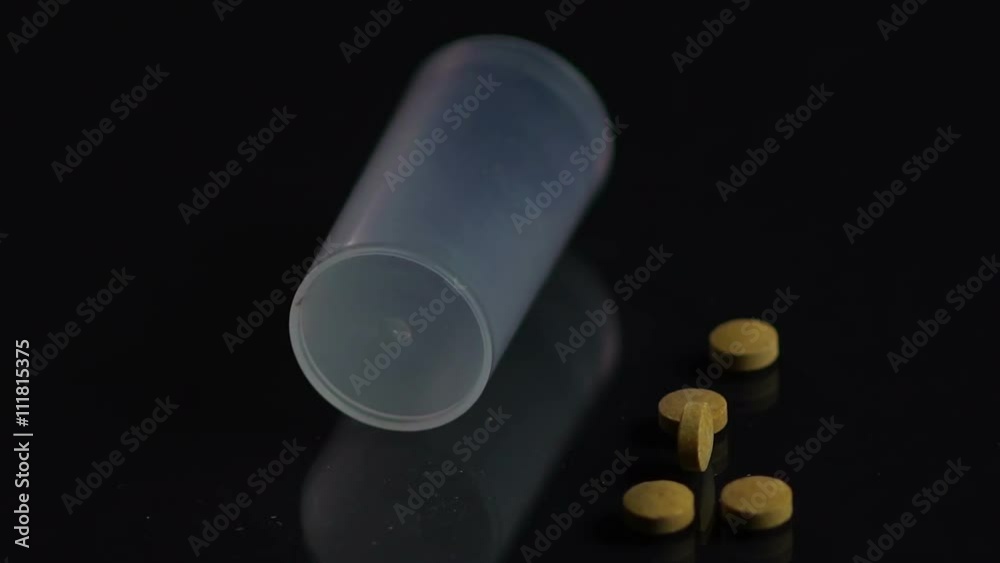 Pill bottle falling on black surface, patient dropping ineffective ...