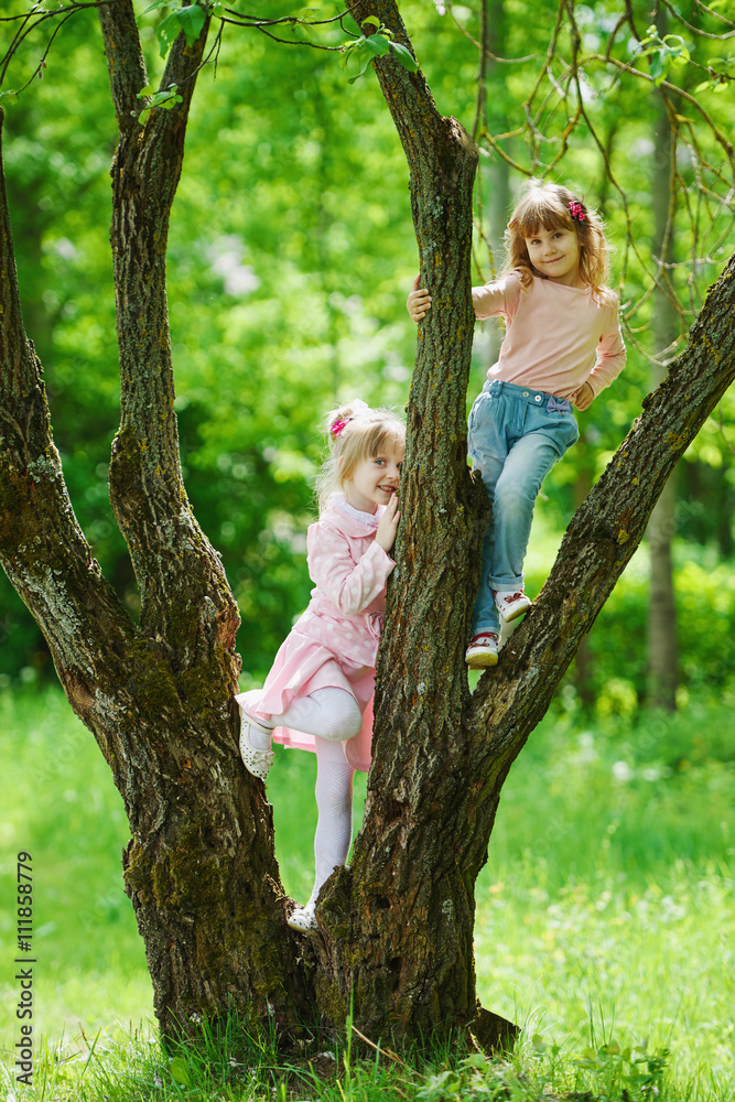 Young Girls Climbing Trees