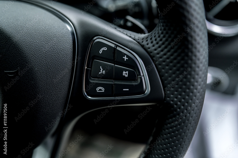 car control buttons ; Interior details. steering wheel with system of ...