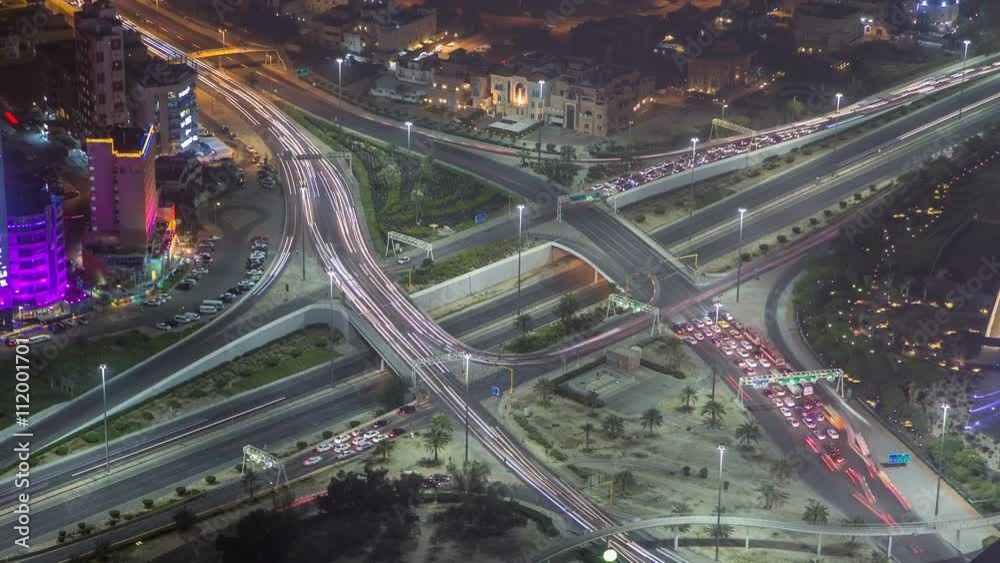 Skyline and traffic on crossroad night timelapse in Kuwait City ...