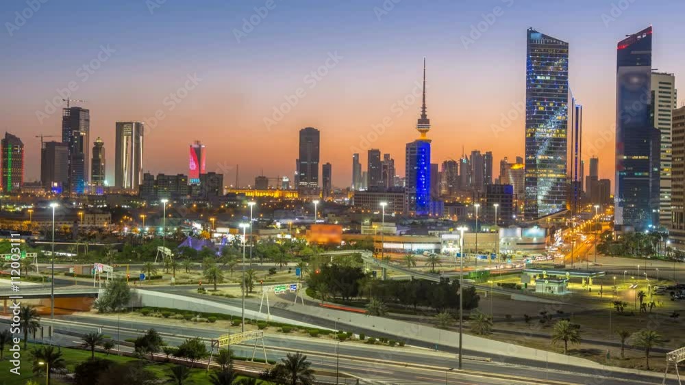 Skyline with Skyscrapers day to night timelapse in Kuwait City downtown ...