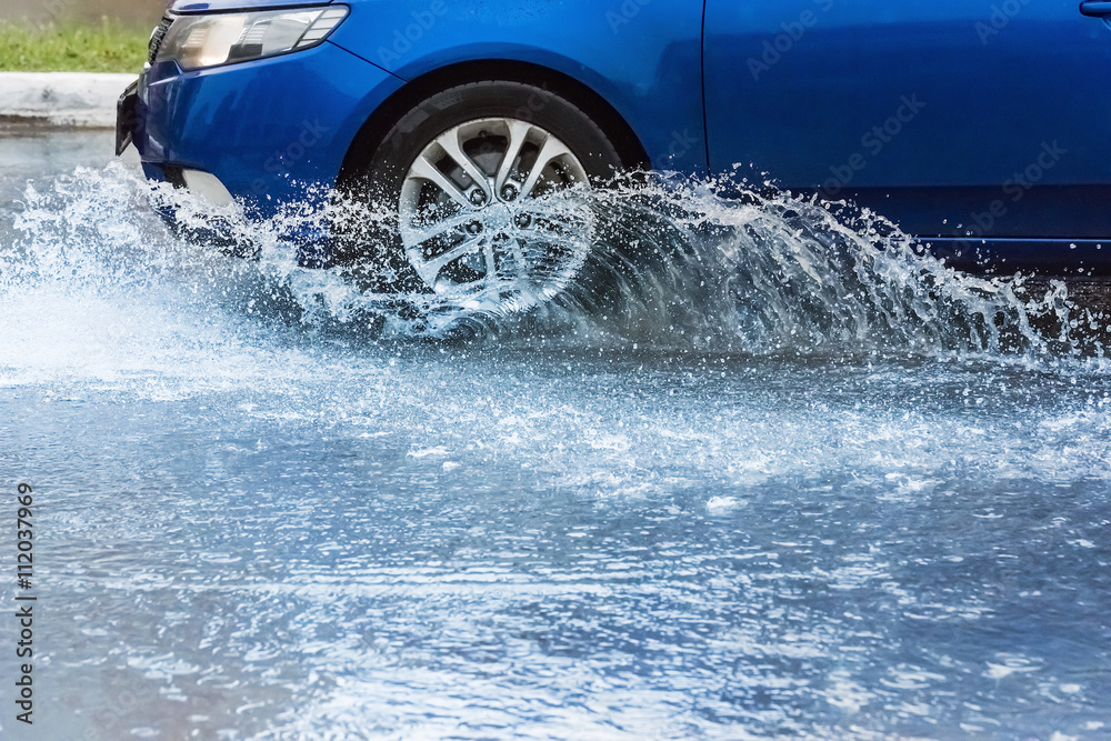car rain puddle splashing water Stock Photo | Adobe Stock