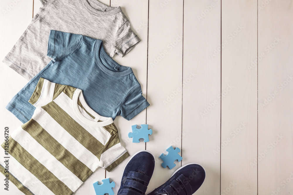 Flat lay children clothing and accessories on wooden background Stock ...