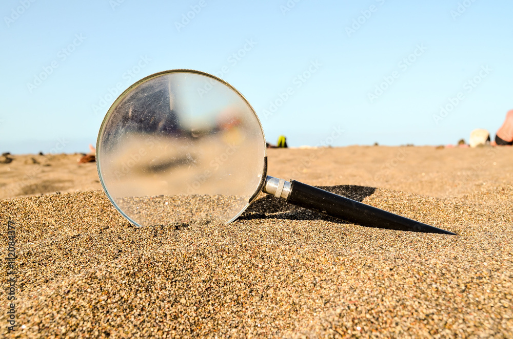 Magnify Glass on the Sand Beach Stock Photo | Adobe Stock