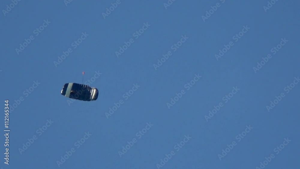 Skydiver moving down fast stunt moves like spiral and making turning ...