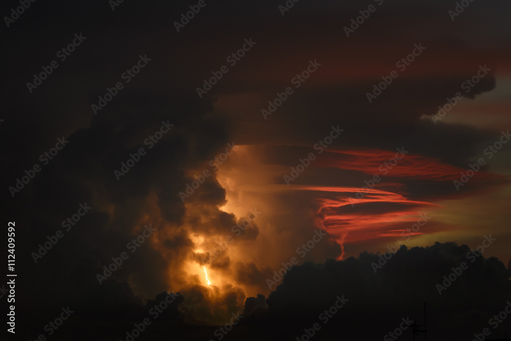 A lightning bolt in the sky during sunset Stock-Foto | Adobe Stock
