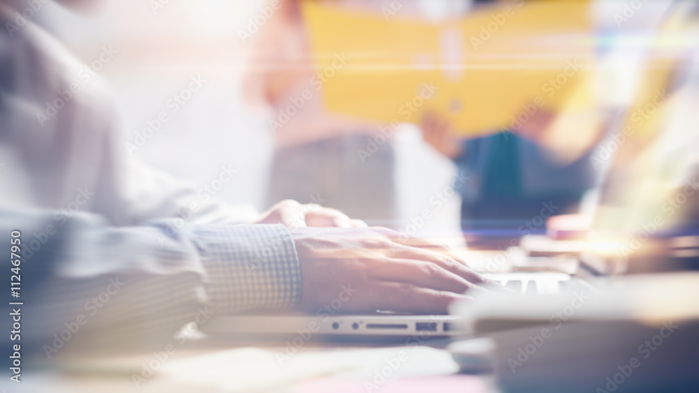 Computer work. Typing with laptop and startup employees. Film effect ...