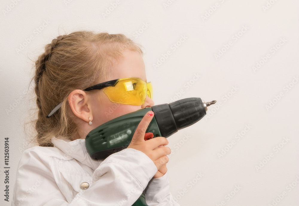 little girl with a tool Stock Photo | Adobe Stock