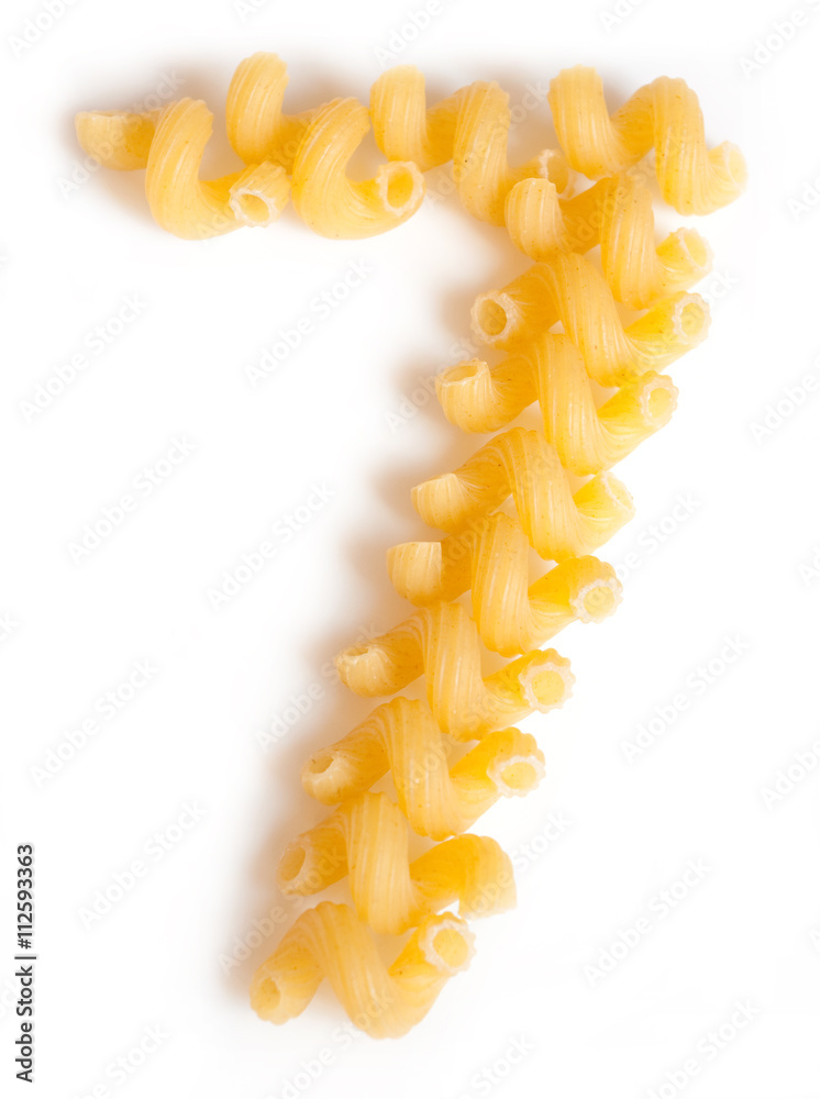 Figure 7 made of macaroni under a daylight isolated on white background ...