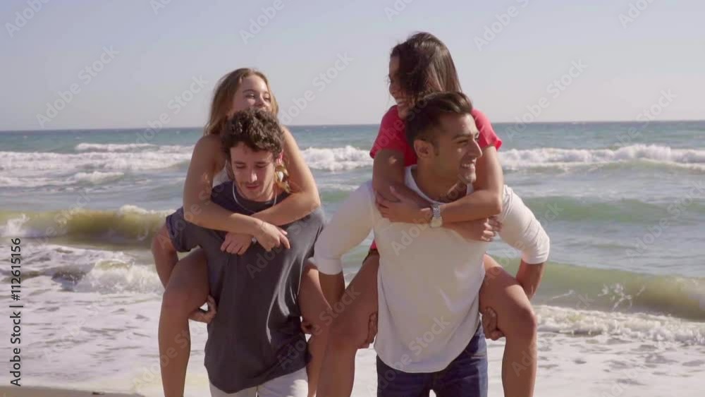 Young nice girls piggyback and shoulder ride on friends shoulder ...