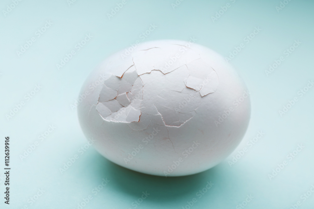 Cracked egg on white background Stock Photo | Adobe Stock