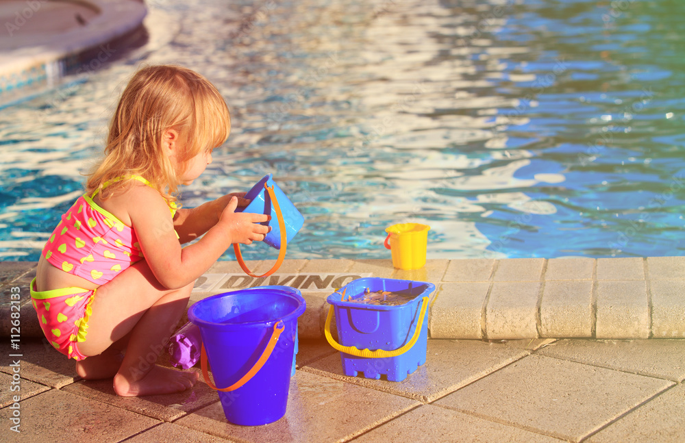 cute little girl playing in swimming pool at beach Stock Photo | Adobe ...