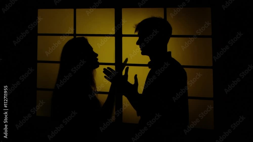 Couples fight. Angry woman hitting a man in the face. Silhouette. Close ...