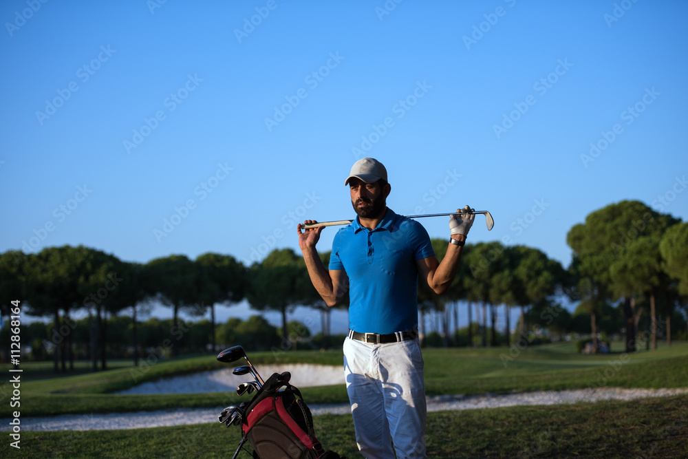 golfer portrait at golf course on sunset Stock Photo | Adobe Stock