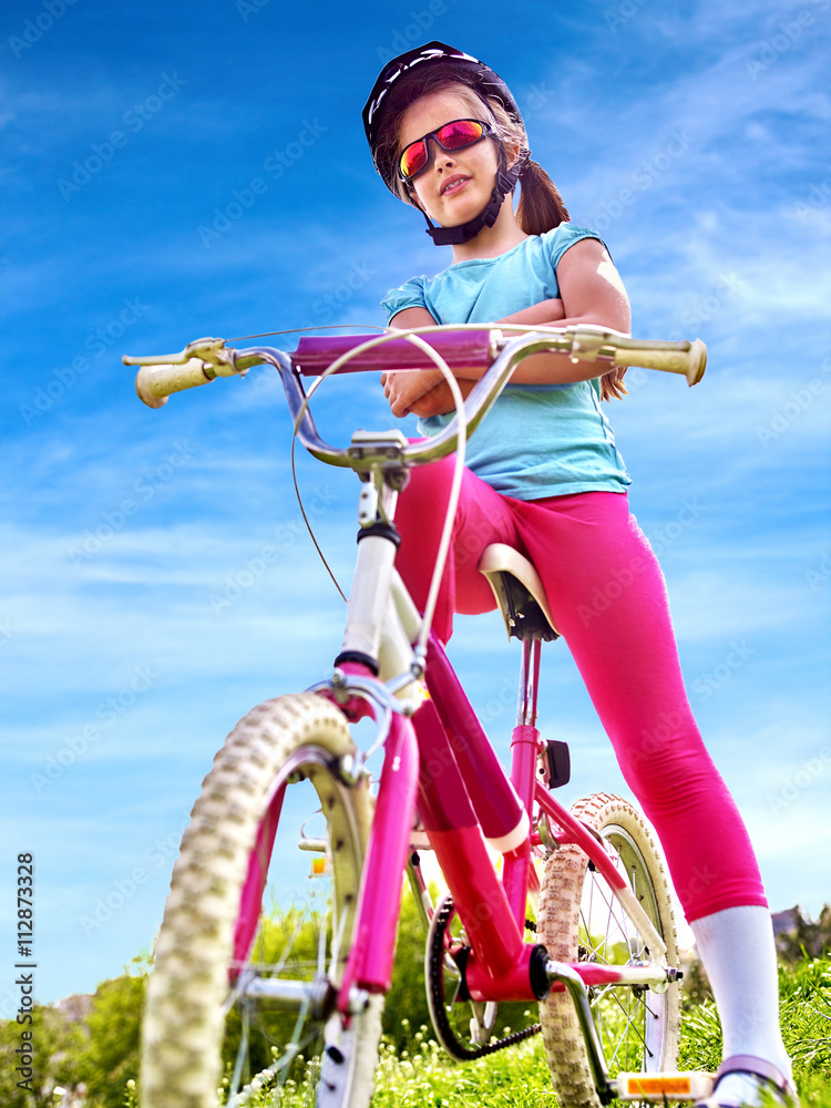 Bikes bicycling child. Child girl rides bicycle. Little girl in cycling ...