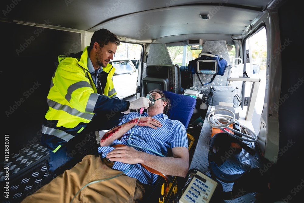 Injured man with ambulance man Stock-Foto | Adobe Stock