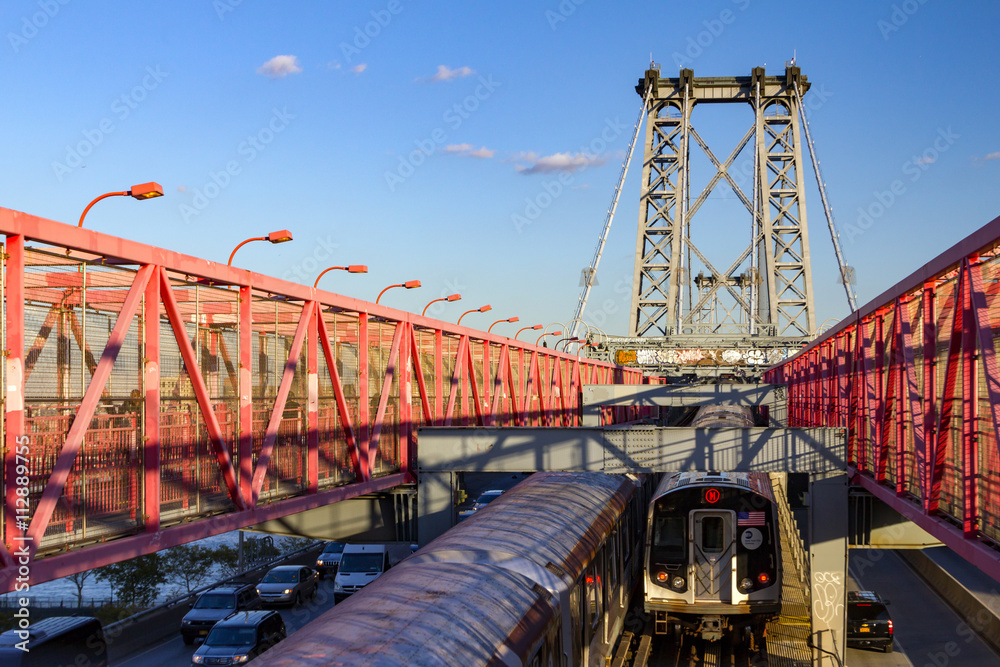 New York City subway trains crossing the Williamsburg Bridge between Manhattan and Brooklyn ...