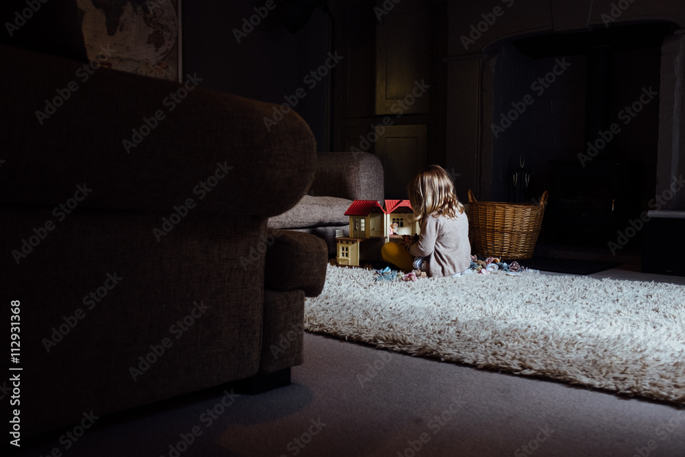 Young girl looking over wall into field with sheep Stock Photo | Adobe ...