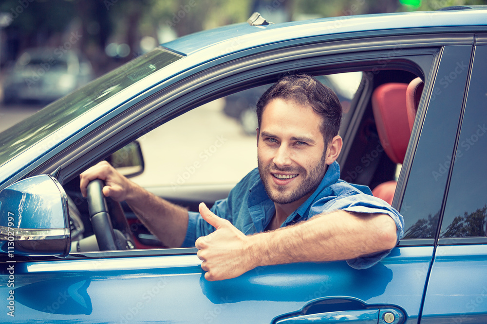 Man driver happy smiling showing thumbs up driving sport blue car Stock ...