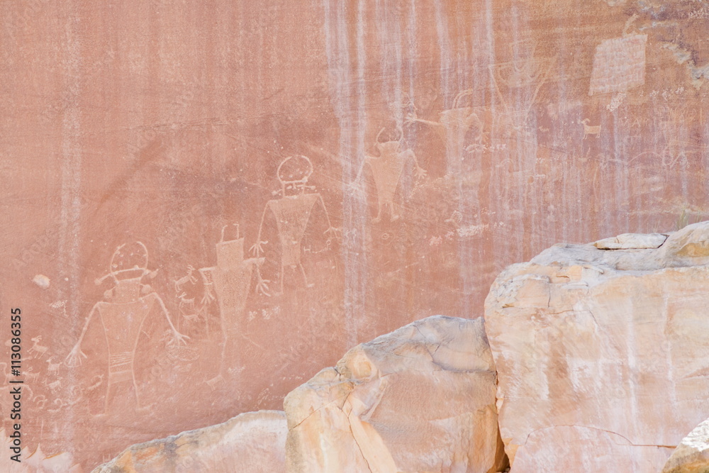 Ancient petroglyphs from the Fremont people on canyon wall, Capitol ...