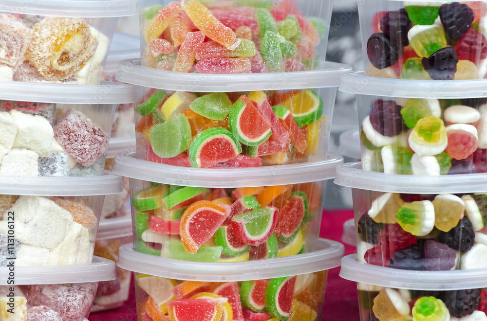 Candy in plastic containers on the market Stock Photo | Adobe Stock