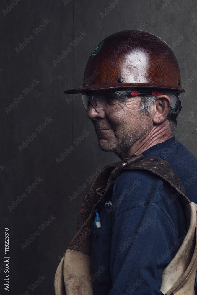 Man wearing safety helmet and protective eyewear Stock Photo | Adobe Stock