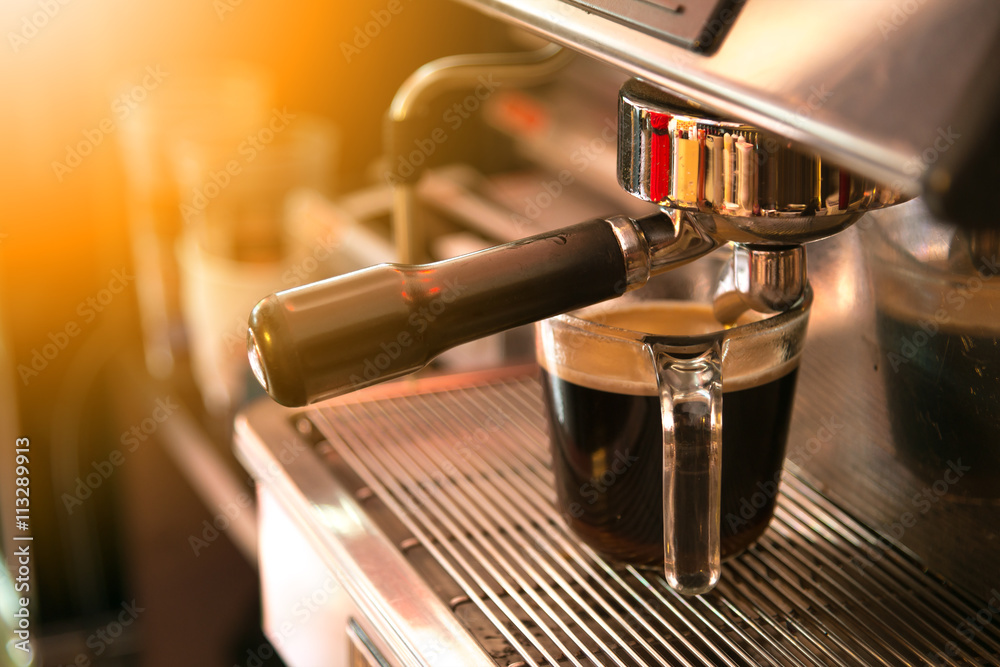 espresso machine making coffee at coffee shop. close up, fresh coffee ...