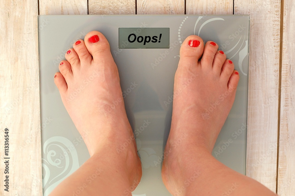 Feet on scales with text oops Stock Photo | Adobe Stock
