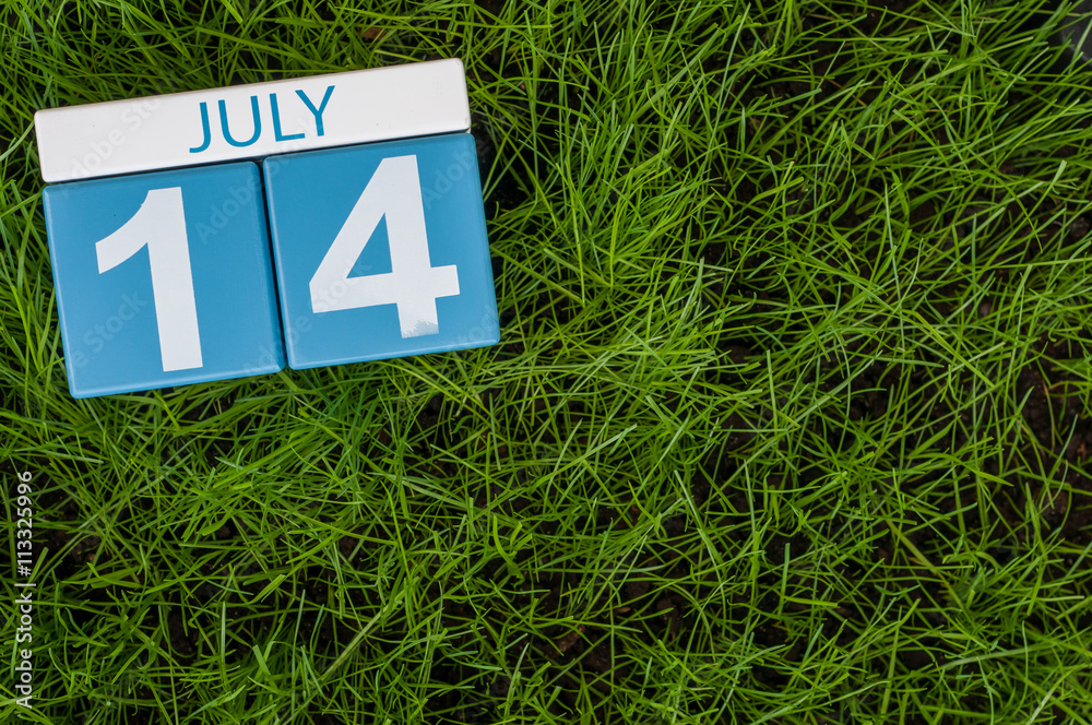 July 14th. Image of july 14 wooden color calendar on greengrass lawn ...
