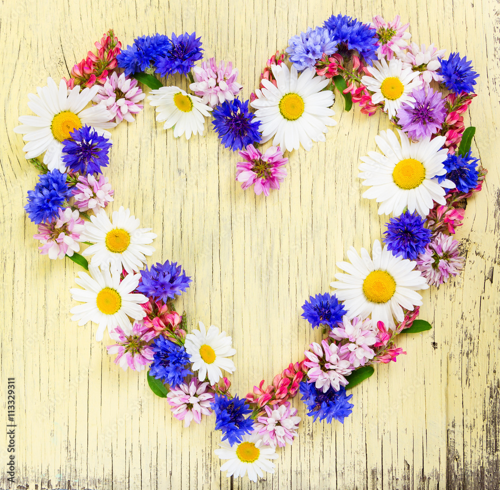 Love concept with heart symbol made of meadow flowers Stock Photo ...