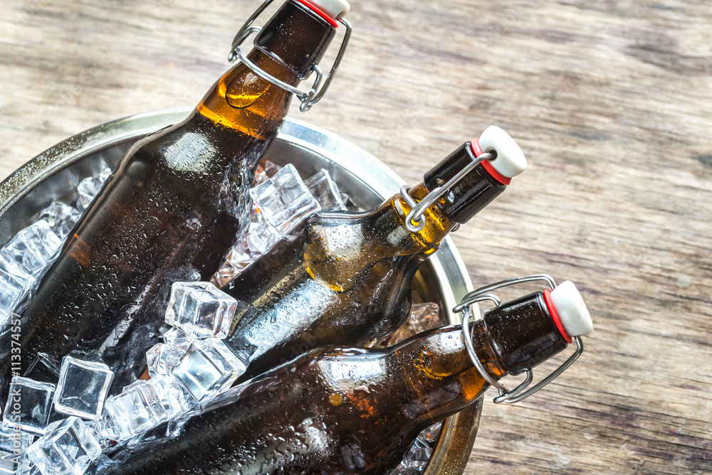Bottles of beer in ice cubes Stock-Foto | Adobe Stock