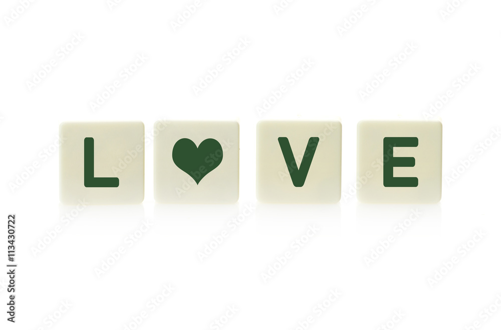 Word "Love" with heart icon on board game square plastic tile pieces ...