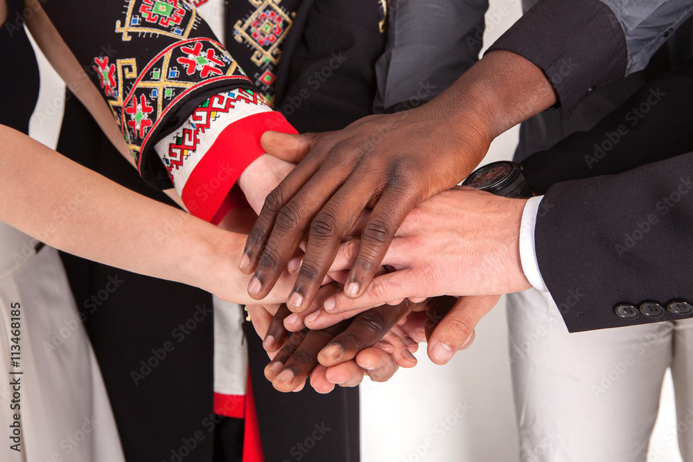 People of different nationalities and religions hold hands. The concept ...