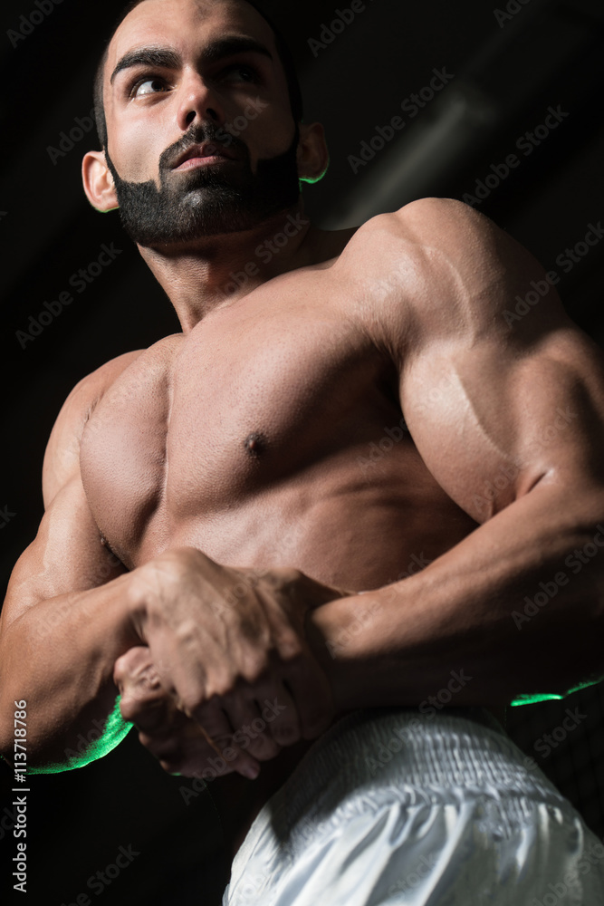 Young Bodybuilder Flexing Muscles Side Chest Pose Stock Photo | Adobe Stock