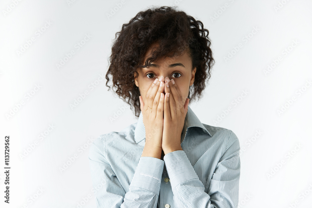Human face expressions. Scared African woman wearing grey shirt ...
