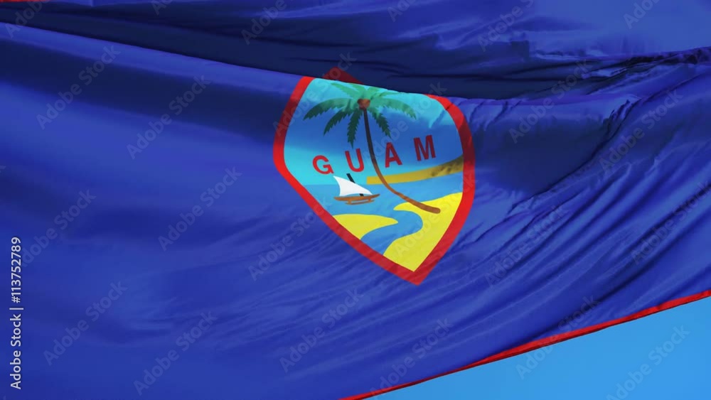 Guam flag waving in slow motion against clean blue sky, seamlessly ...