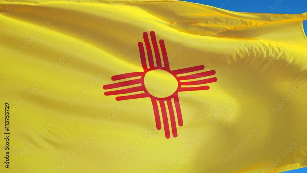 New Mexico flag waving in slow motion against clean blue sky ...