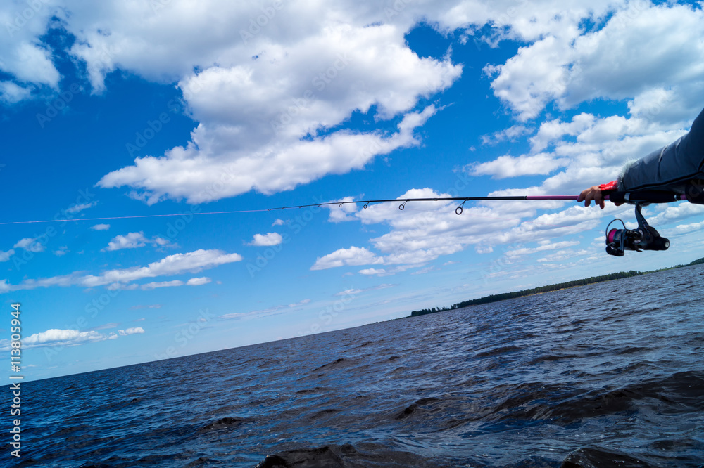 fishing from a boat, Trolling fishing boat rod, sky scenery above the ...