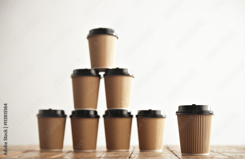 One cup presented in focus in front of craft cardboard take away paper ...