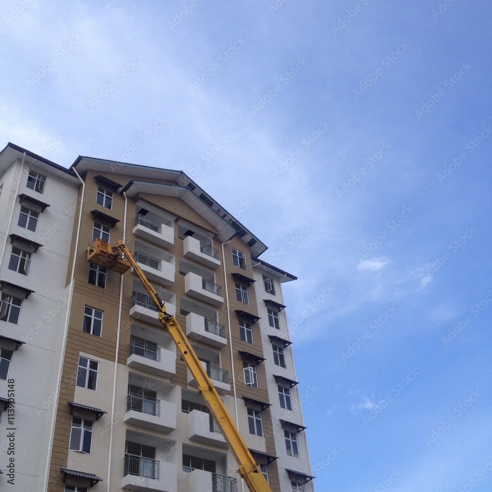 Installing window hood using a crane Stock Photo | Adobe Stock