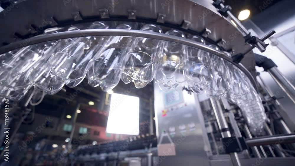 Modern clean Production line of carbonated drinks. Empty plastic ...