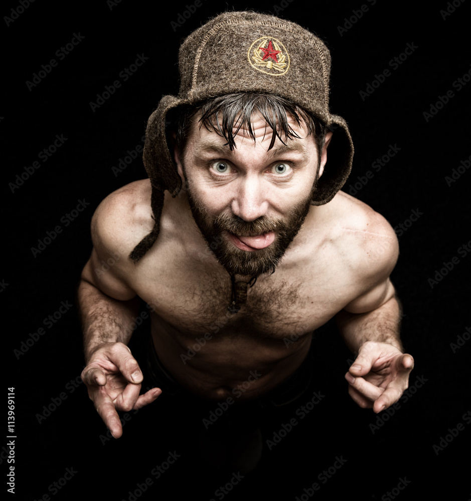 Dark portrait of scary evil sinister bearded man with smirk, makes ...