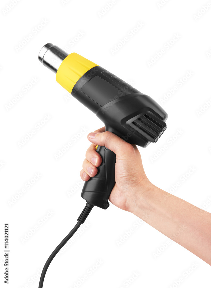 Heat gun in hand Stock Photo | Adobe Stock