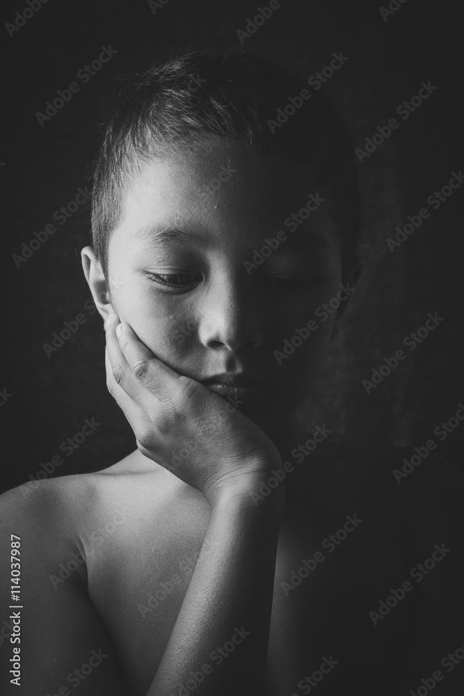 scared and alone, young Asian child who is at high risk of being ...