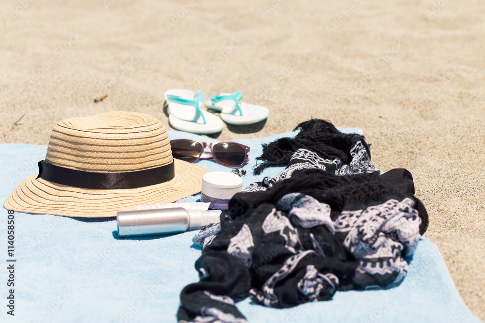 Typical beach gear of beauty products and care with female things for ...