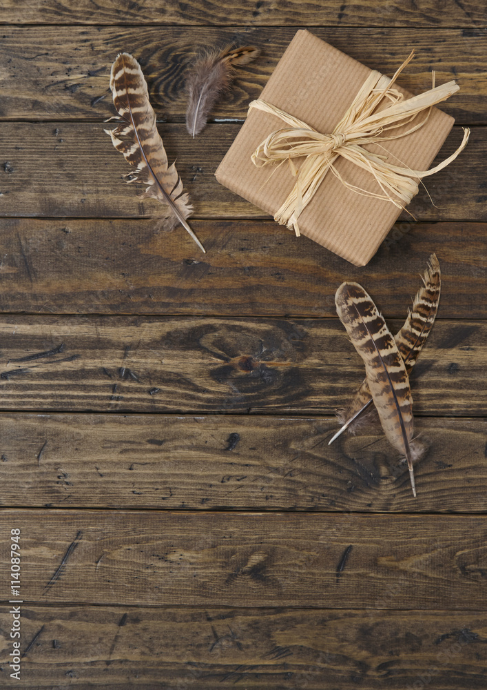 Gift wrap - Present wrapped in brown parcel paper with raffia bow and ...