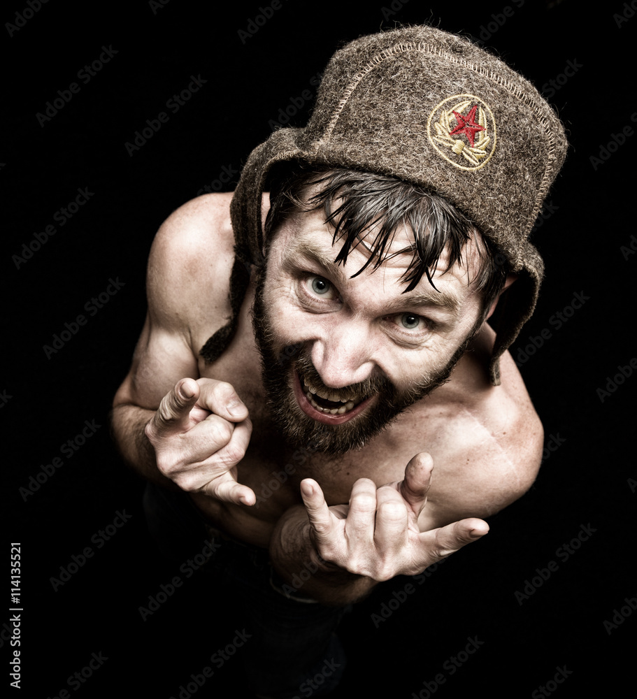 Dark portrait of scary evil sinister bearded man with smirk, makes ...