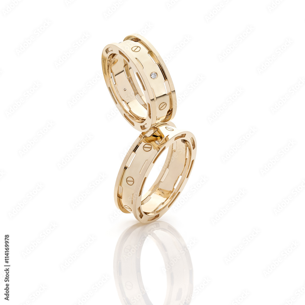 two golden rings on the white background with reflection Stock Photo ...